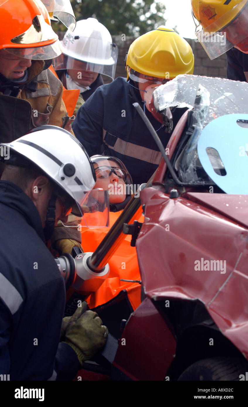 Firefighters cut open a car during a training drill Stock Photo - Alamy