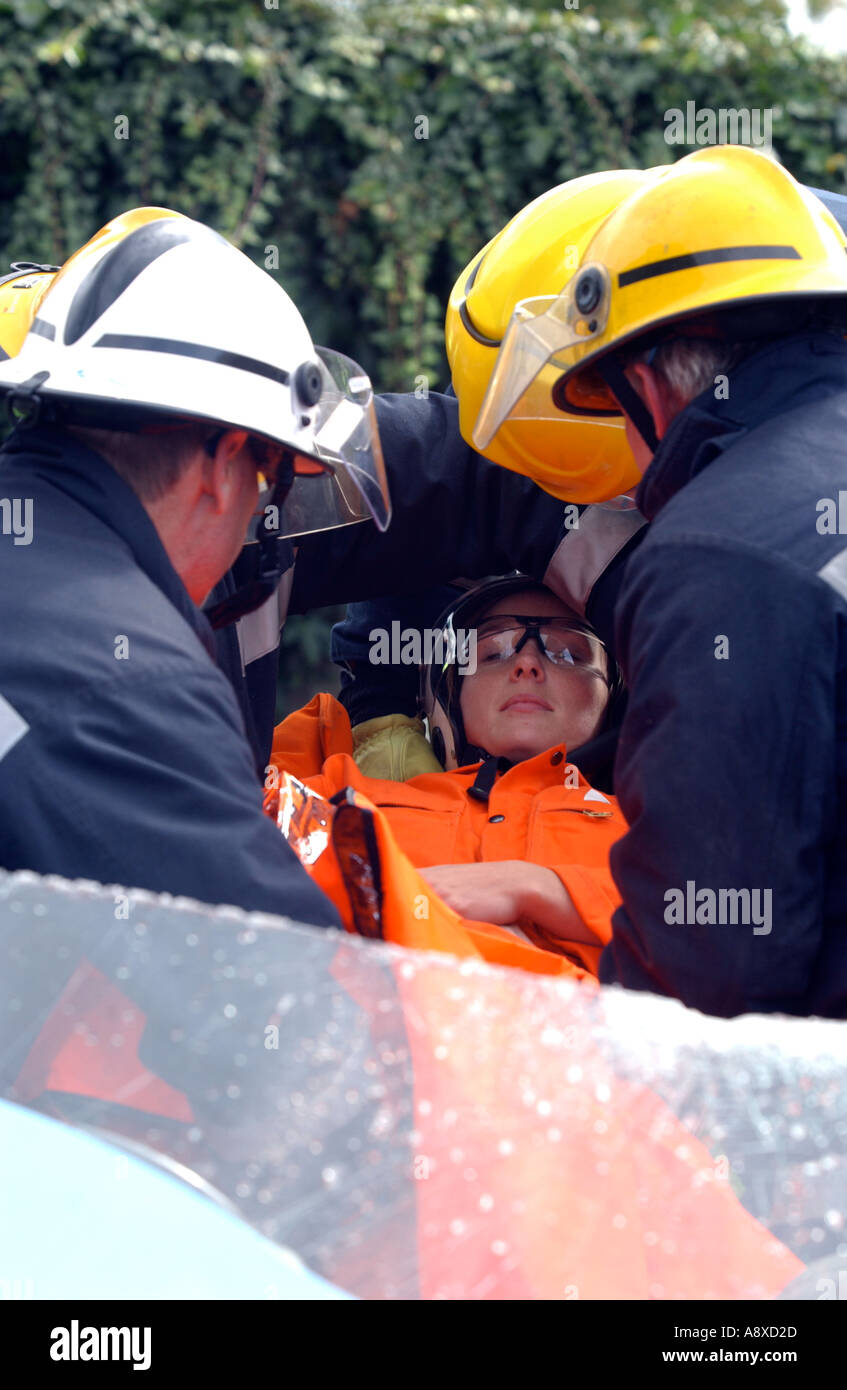 Firefighters cut open a car during a training drill Stock Photo - Alamy