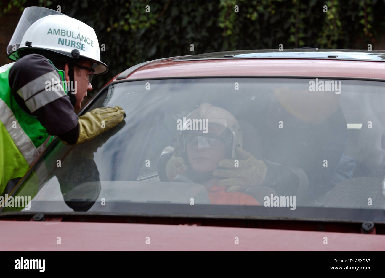 Firefighters cut open a car during a training drill Stock Photo - Alamy