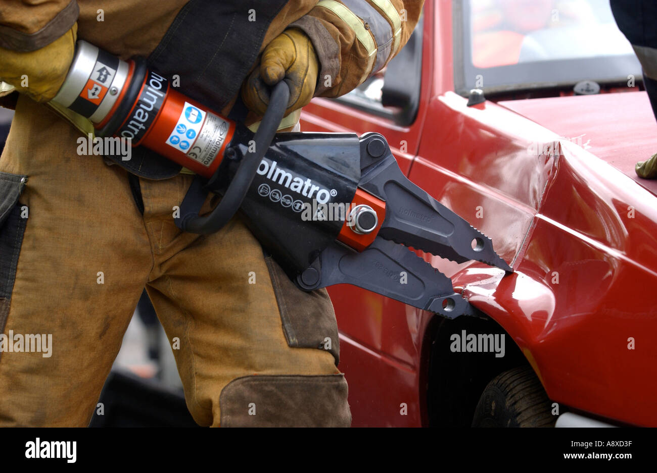 Firefighters cut open a car during a training drill Stock Photo - Alamy
