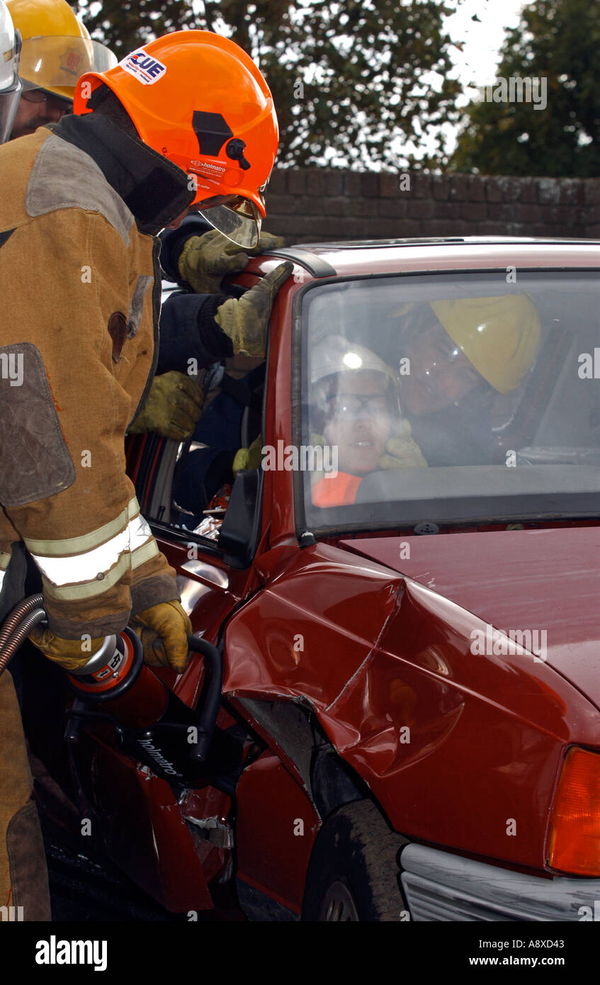 Firefighters cut open a car during a training drill Stock Photo - Alamy