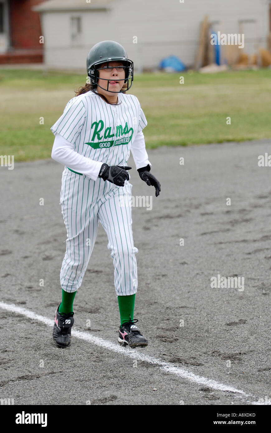 Baseball action girls playing softball hi-res stock photography and ...
