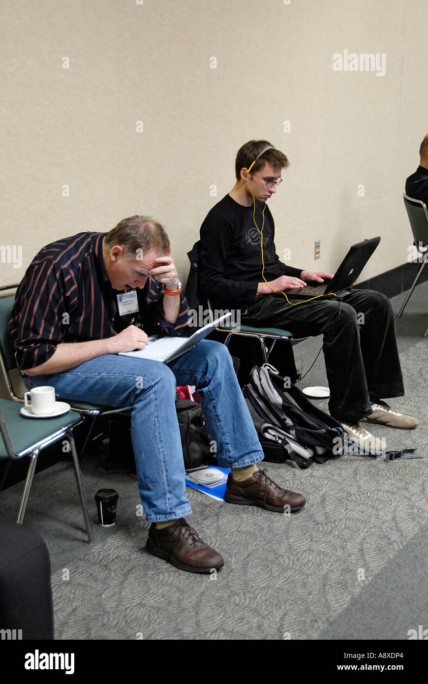 Adult businessman professional works on wireless laptop computer while ...