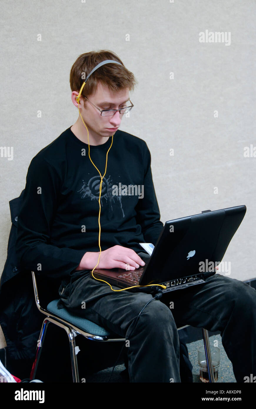 Adult businessman professional works on wireless laptop computer while ...