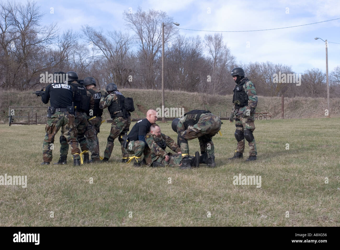 SWAT team training Retrieving injured officer from line of fire hot ...