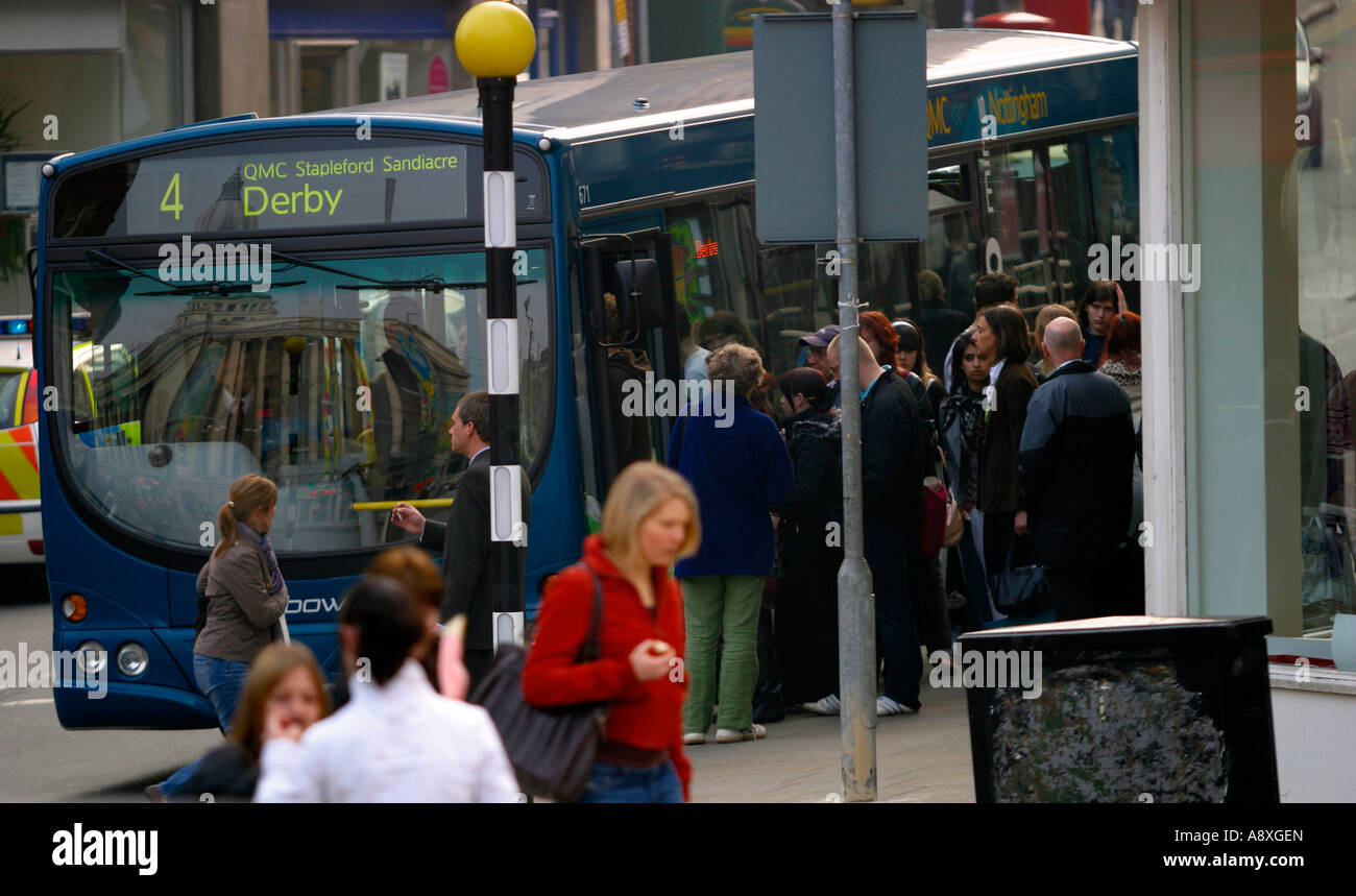 A Nottingham to Derby bus. Passengers board the single deck vehicle ...