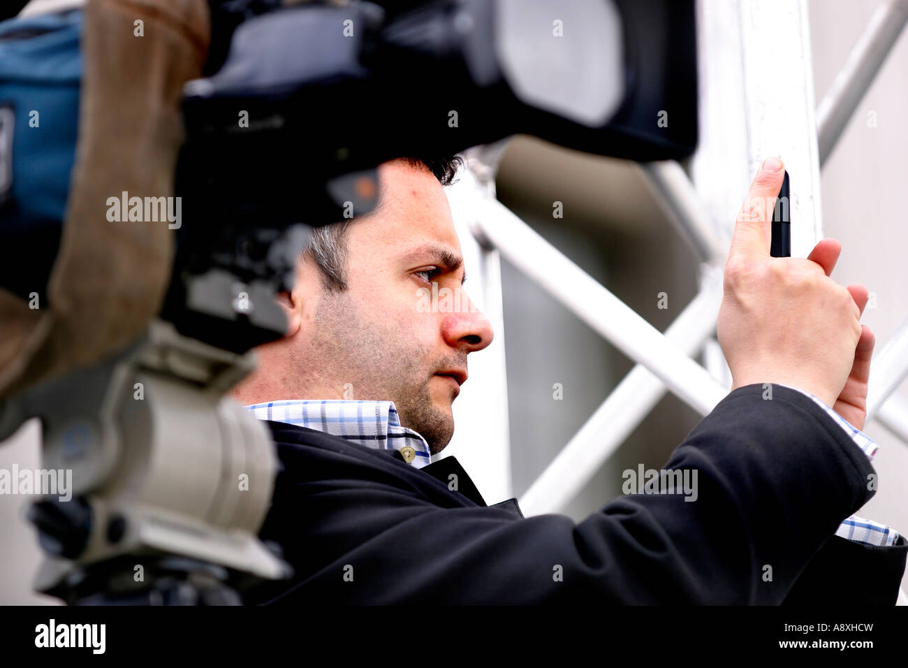 BBC radio journalist taking pictures for the BBC website using his ...
