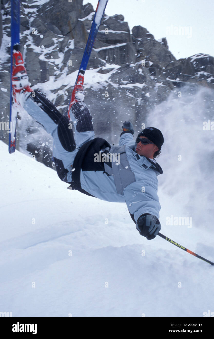 young man flying through the air ski fall Stock Photo - Alamy