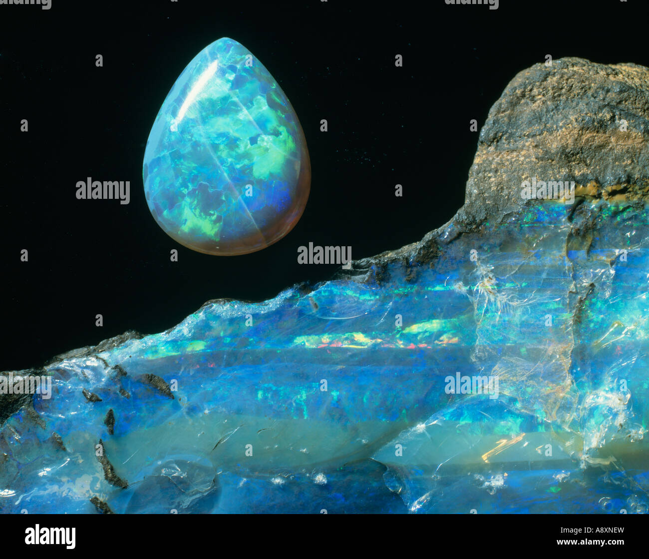 Opal gem with opal rock Stock Photo - Alamy