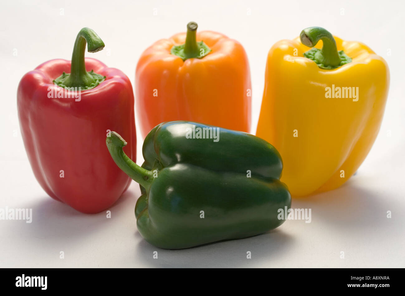 A red green yellow and orange pepper capsicum Stock Photo - Alamy