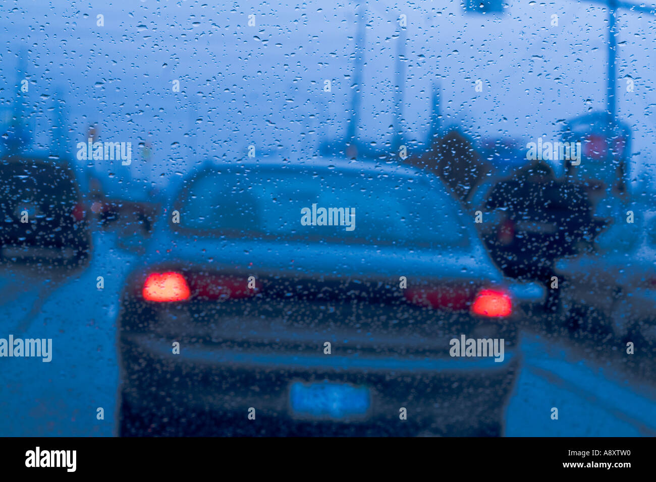 driving on a rain, wet windshield heavy traffic Stock Photo - Alamy