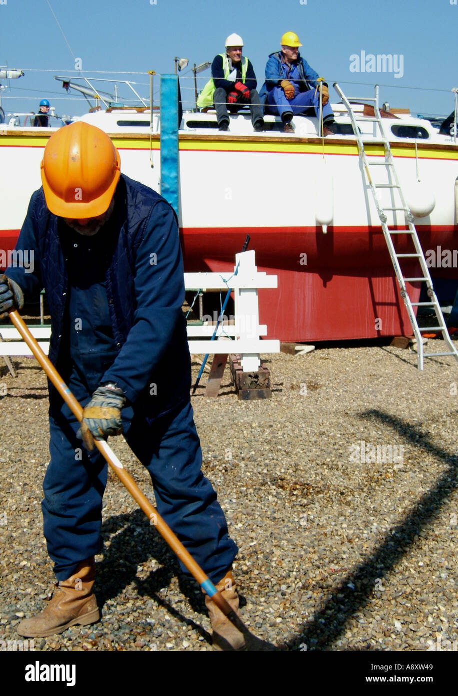 workman in boatyard Stock Photo - Alamy