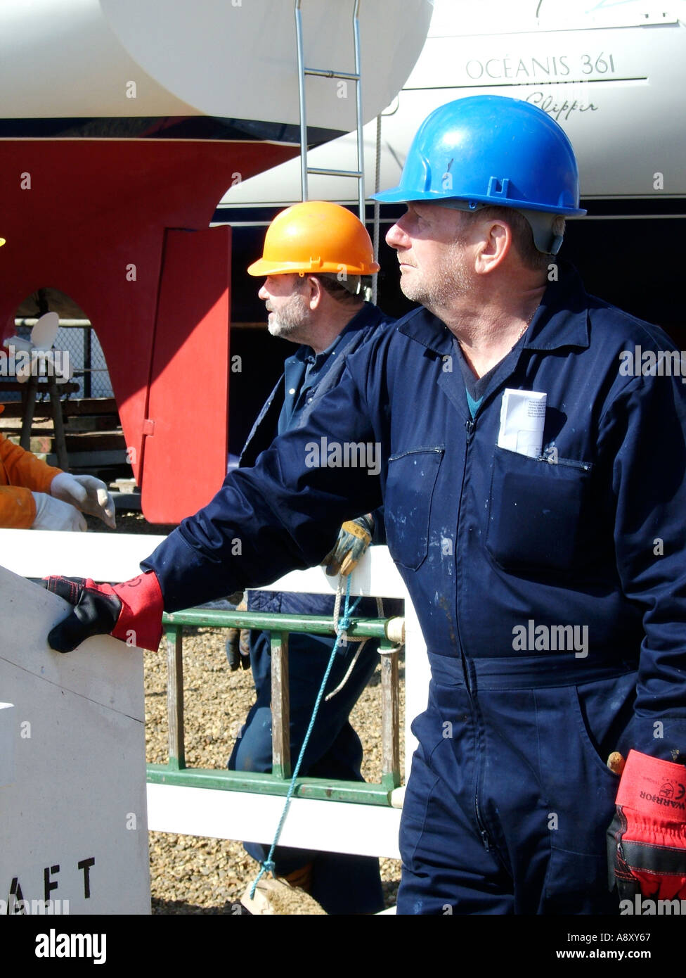 workman in boatyard Stock Photo - Alamy