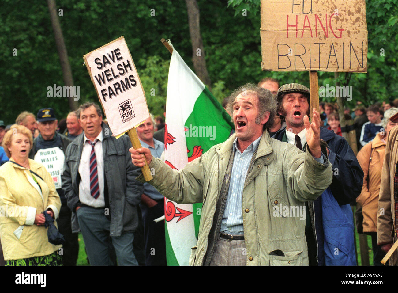 Farmers sing the Welsh National Anthem at a rally to save Welsh farms ...