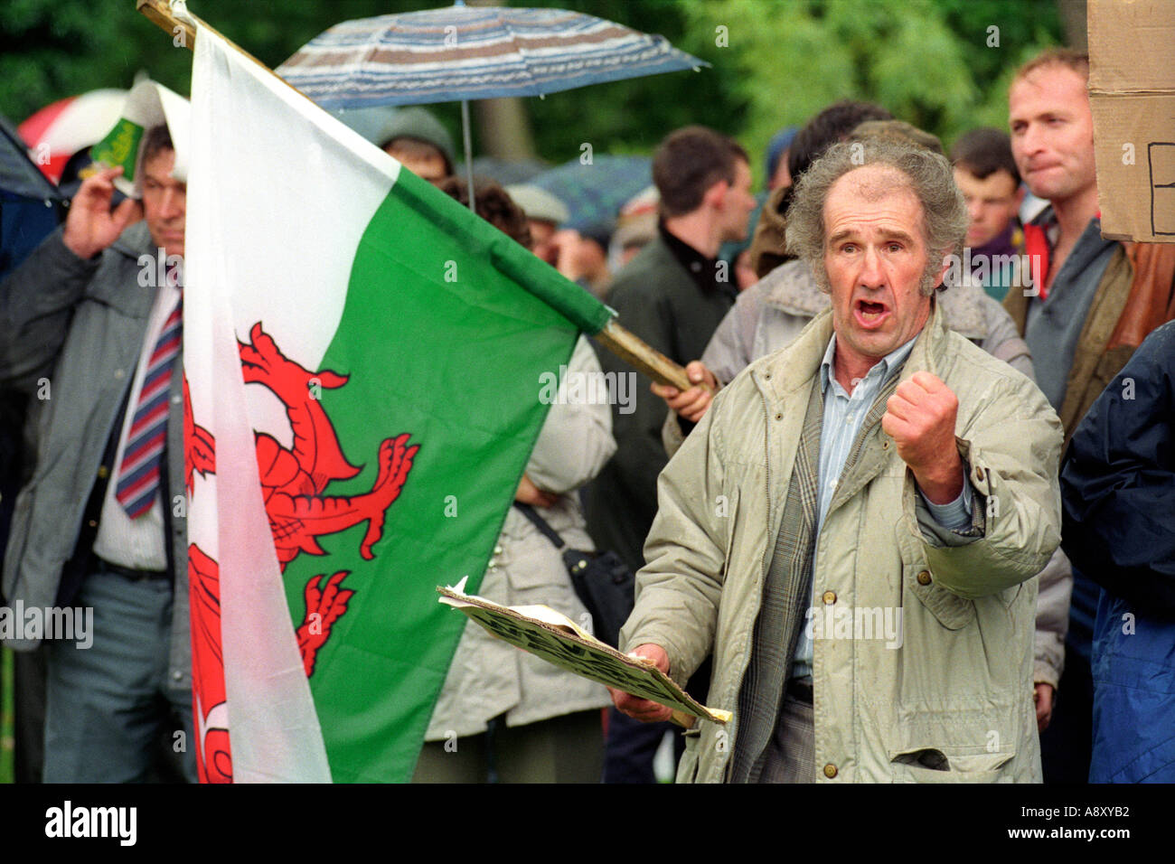 Farmers sing the Welsh National Anthem at a rally to save Welsh farms ...