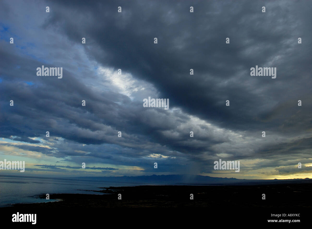 Sunrise and a rain shower The South Kohala coast The Big Island of ...