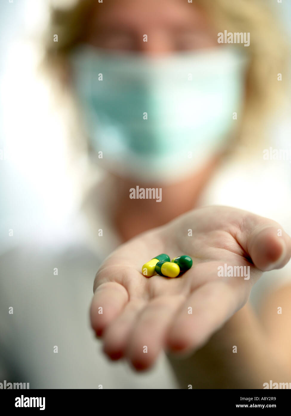 a health worker handing out medication to patient Stock Photo - Alamy