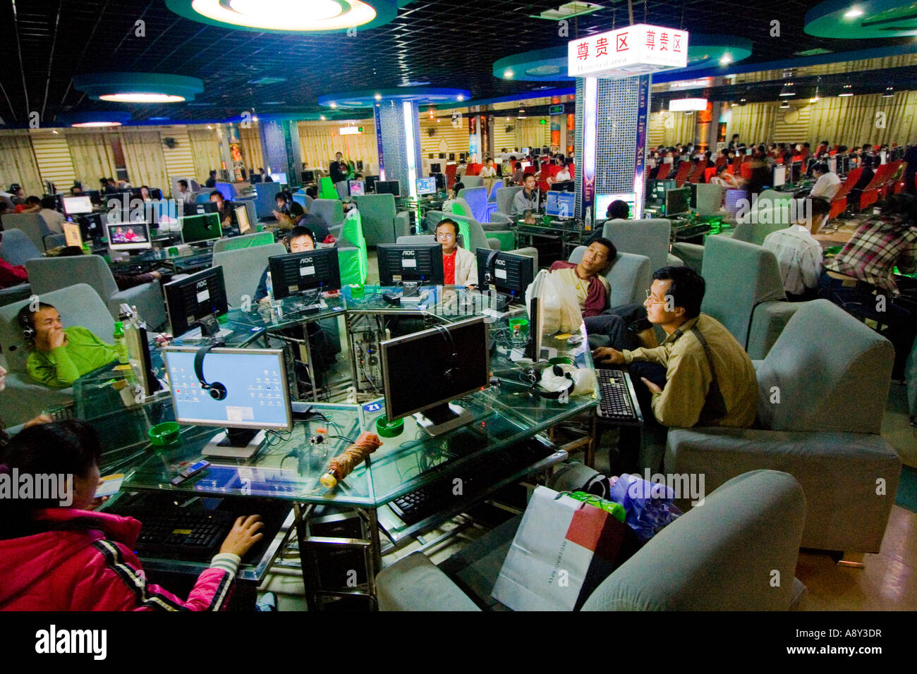 Young People Online at an Upscale Boutique Internet Cafe Gaming and ...