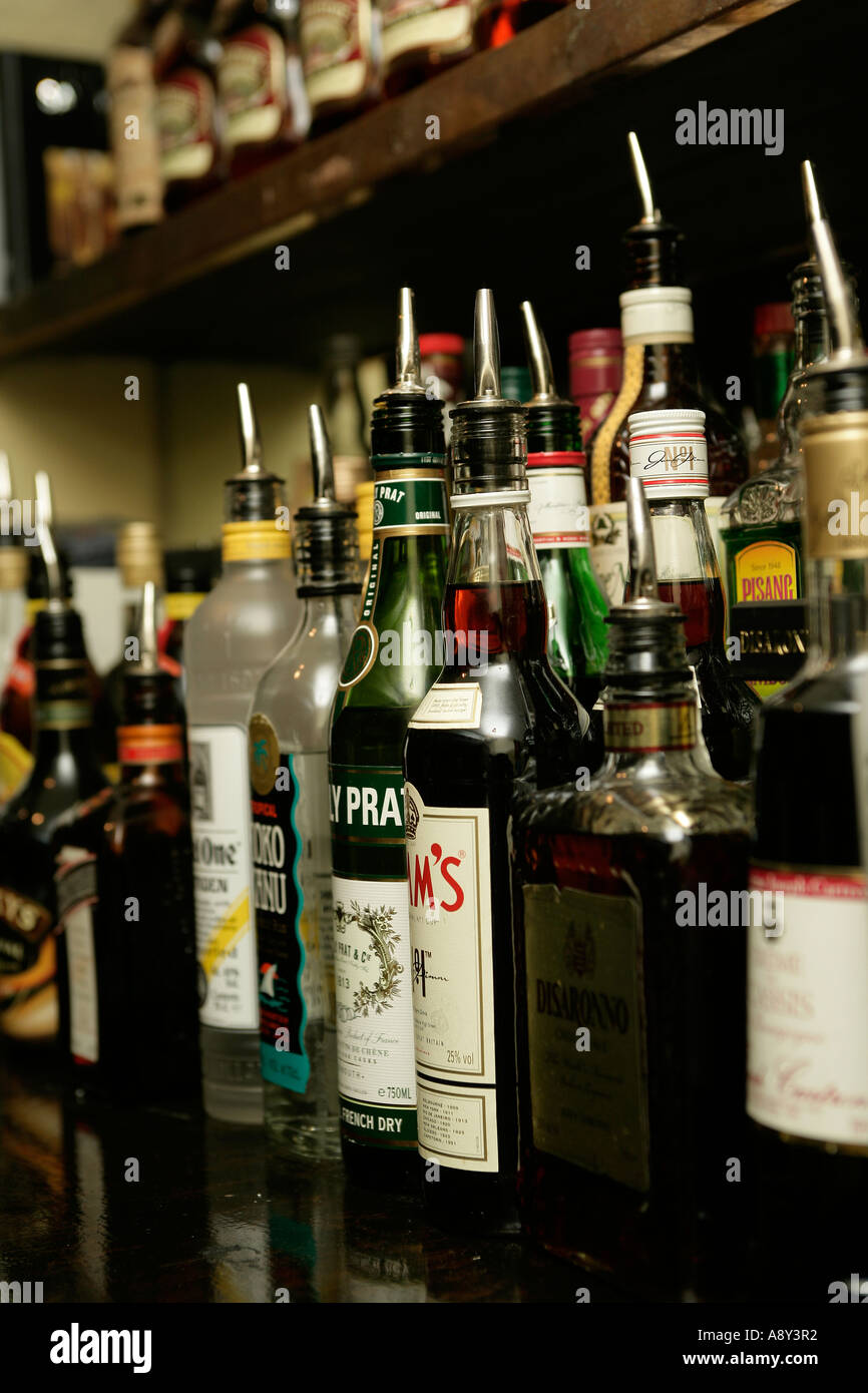 Bottles behind a bar Stock Photo - Alamy