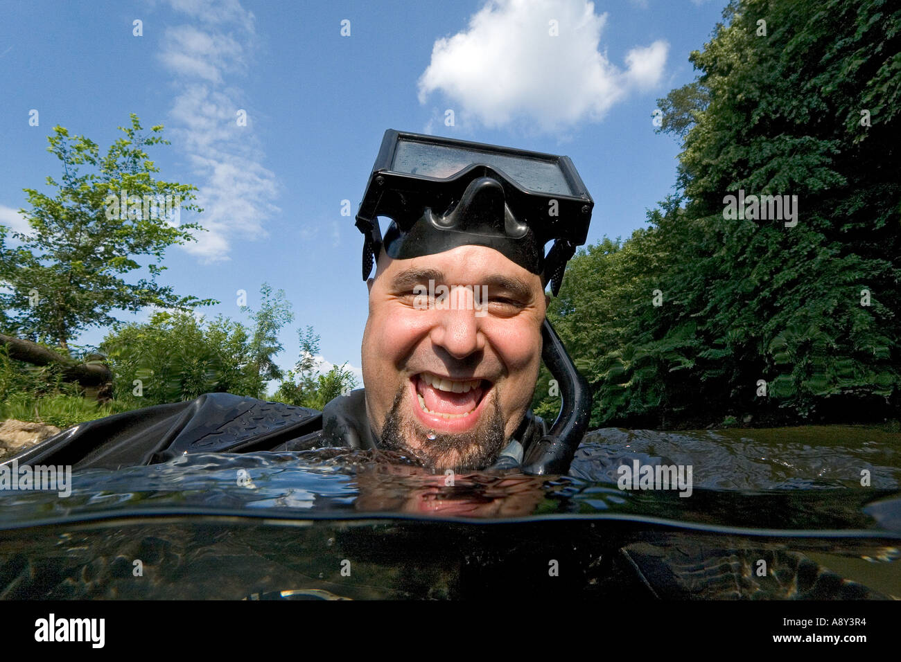 Happy snorkeller after a dive in the Creuse river (France). Plongeur ...