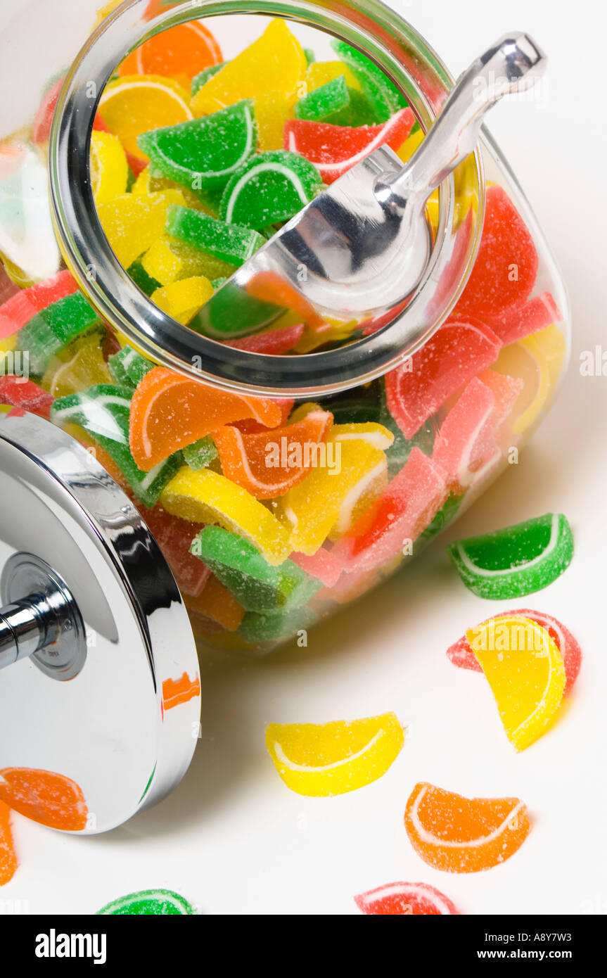 Fruit flavored gummy candy in glass container with metal lid off Stock ...