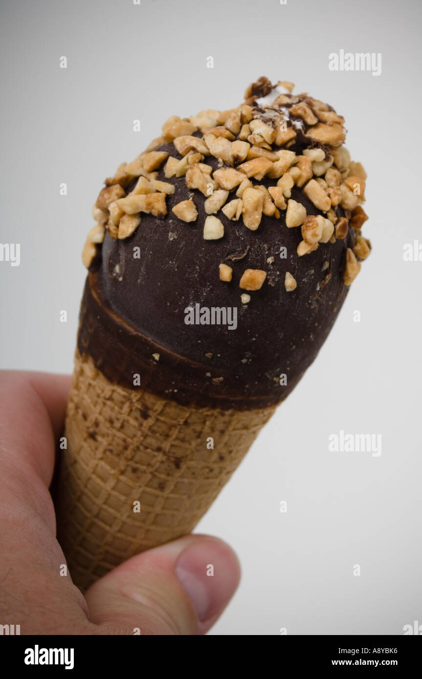 Man holding chocolate covered ice cream cone Stock Photo - Alamy