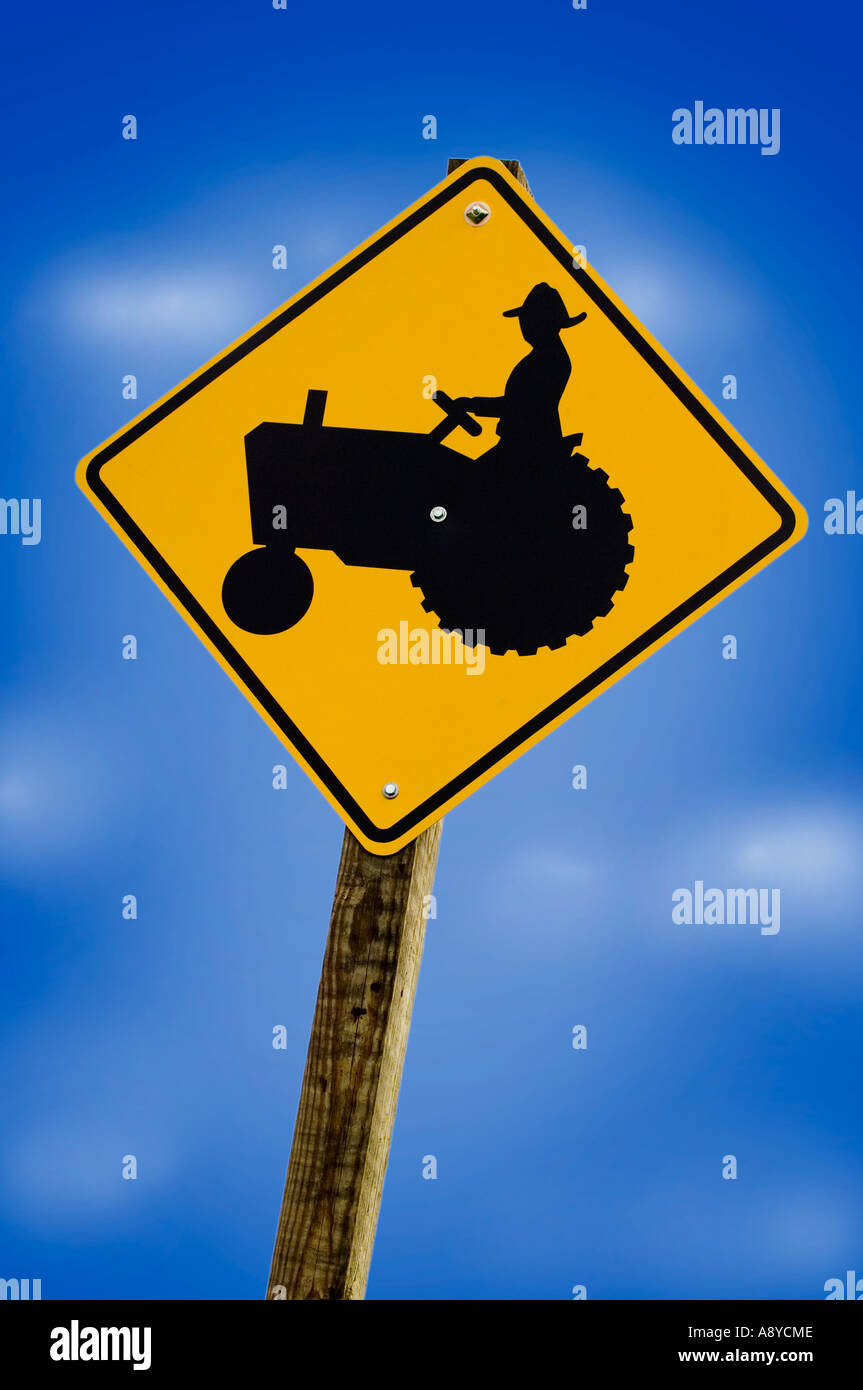 Yellow tractor crossing road sign hi-res stock photography and images ...