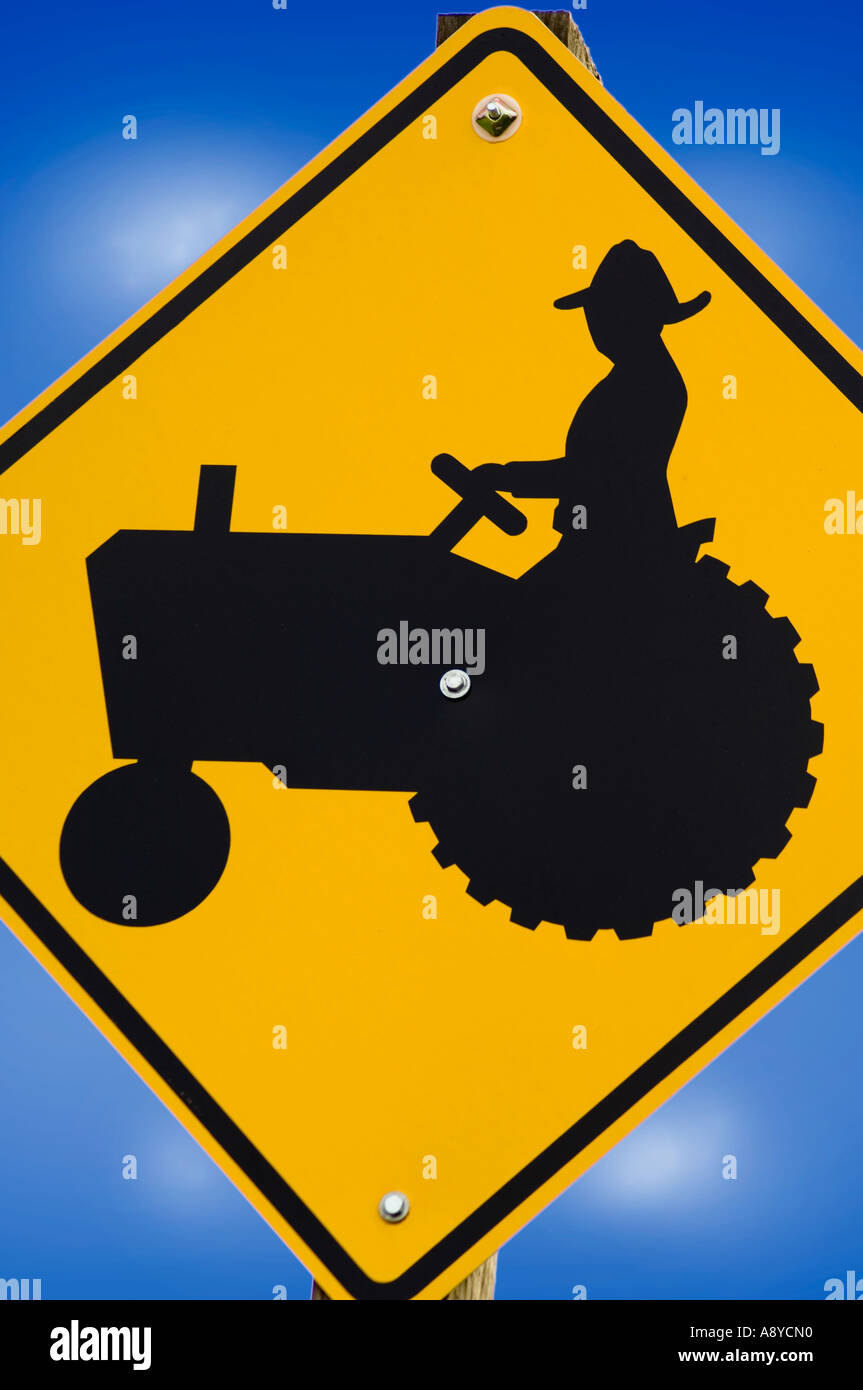 Yellow tractor crossing road sign hi-res stock photography and images ...
