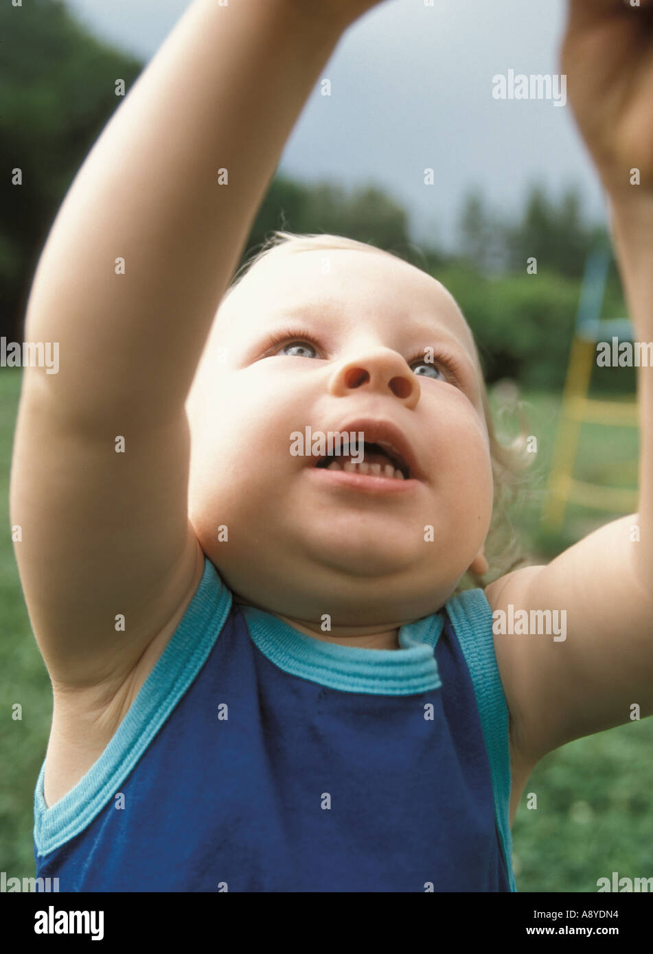 baby girl raising hands MR8407 Stock Photo - Alamy