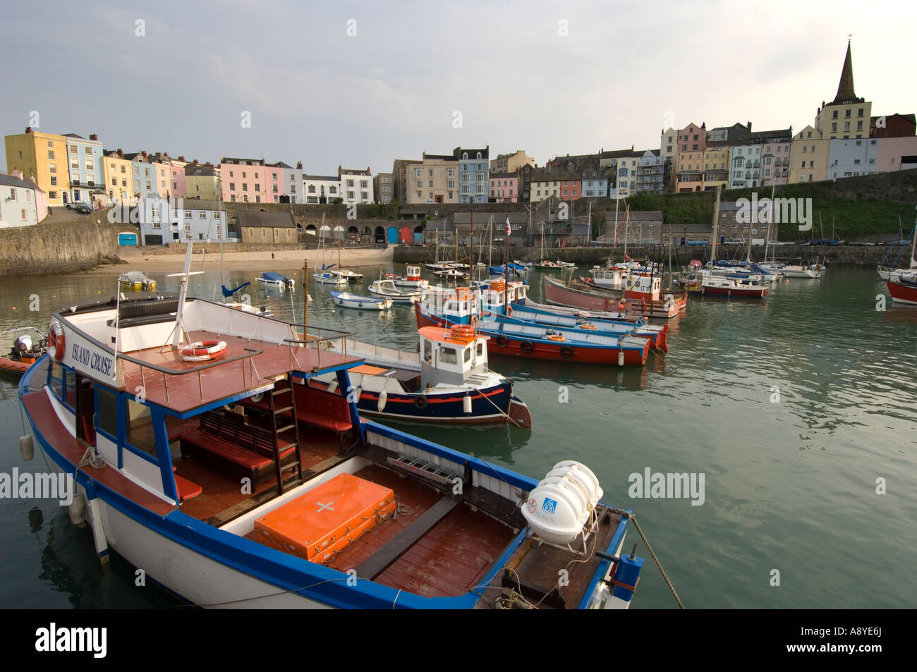 tenby wales - fishing boats and pleasure craft in the harbour at high ...