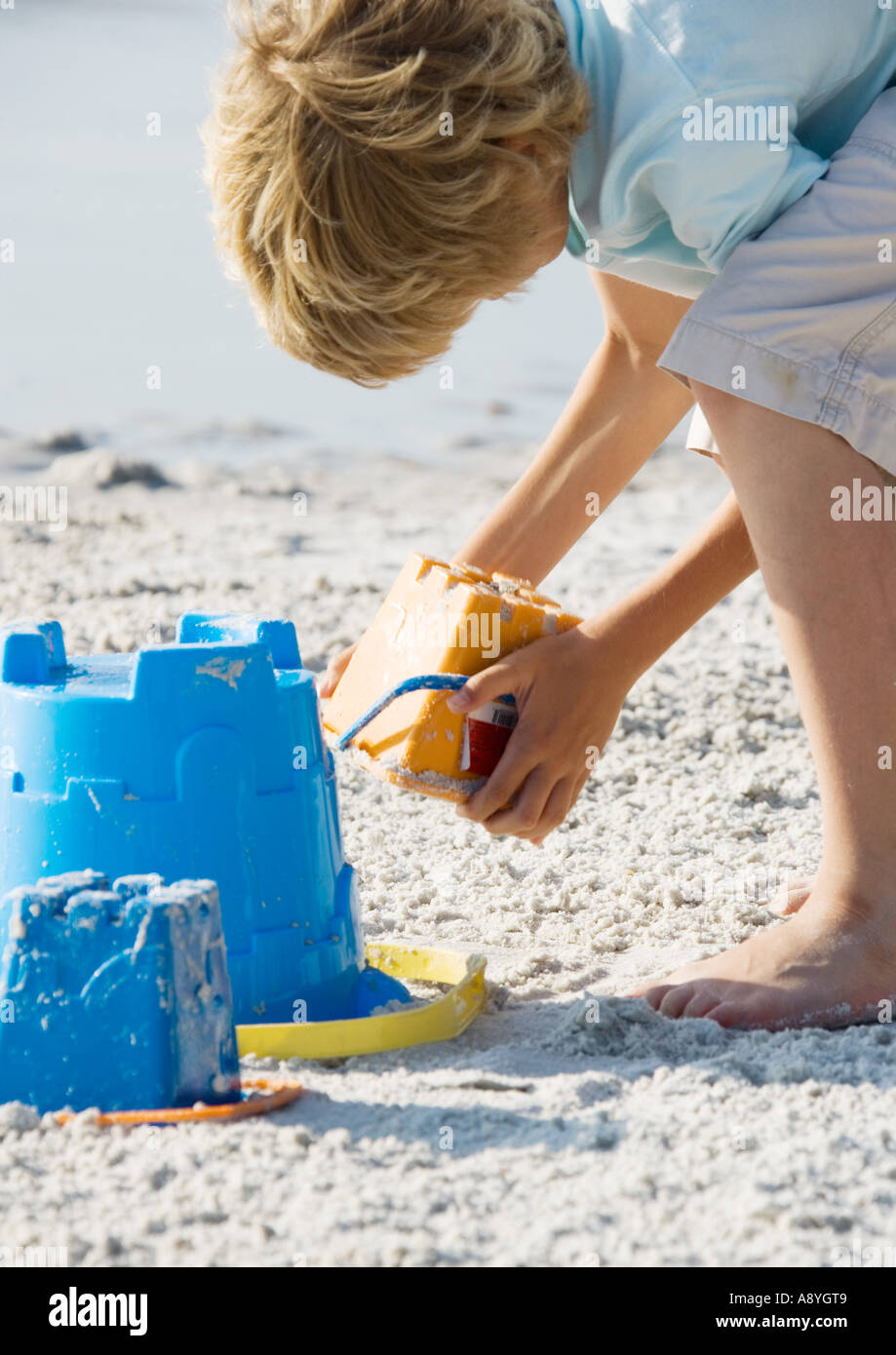 Boy making sandcastles hi-res stock photography and images - Alamy