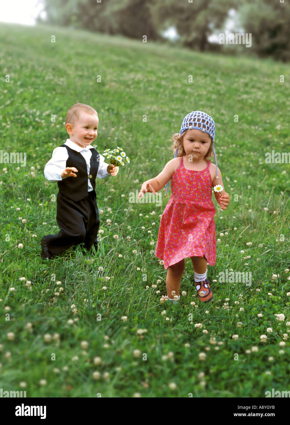 Boy running after girl MR8423 Stock Photo - Alamy