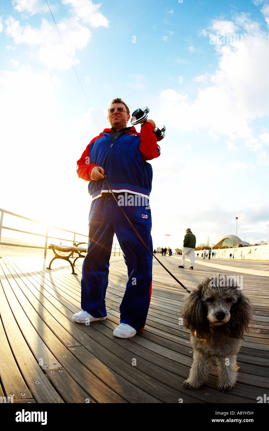 Man and his Dog on Boardwalk in Coney Island Stock Photo - Alamy