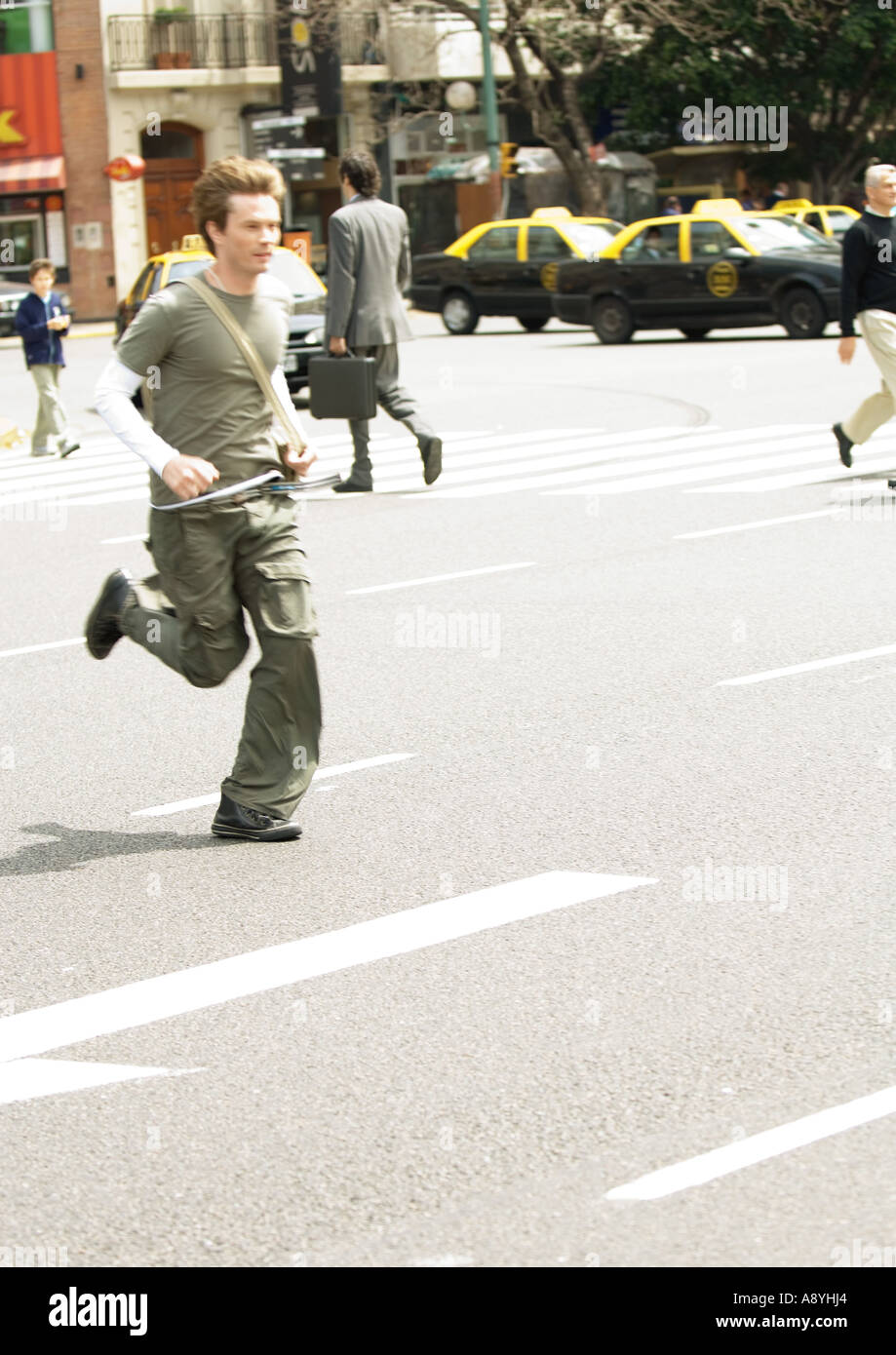 Running across zebra crossing hi-res stock photography and images - Alamy