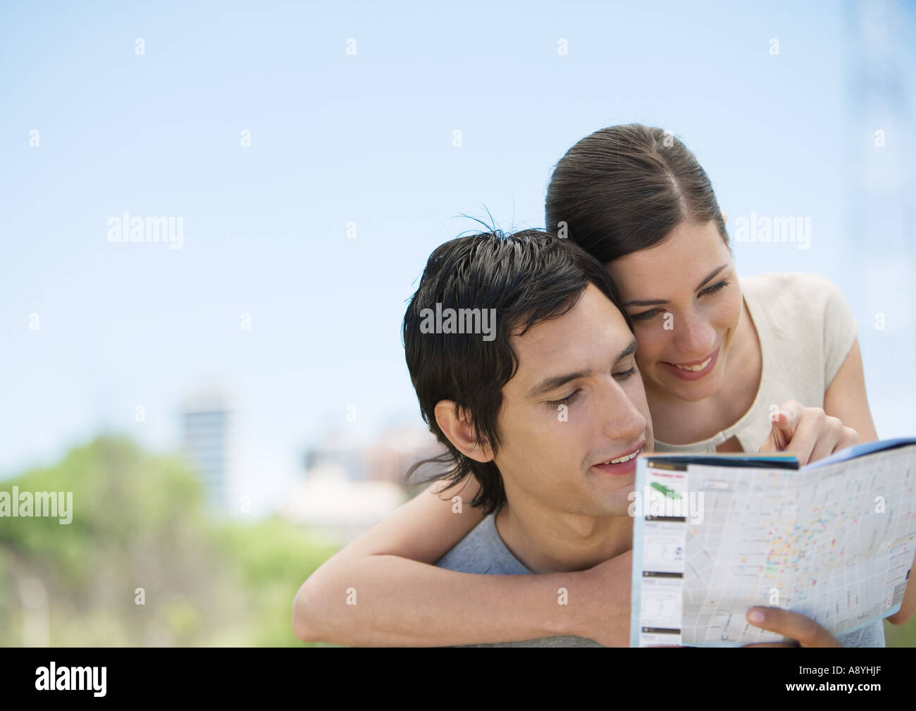 Young couple looking at map Stock Photo - Alamy
