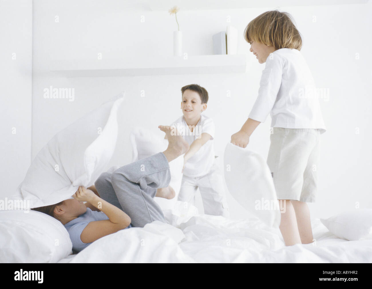 Three siblings fighting hi-res stock photography and images - Alamy