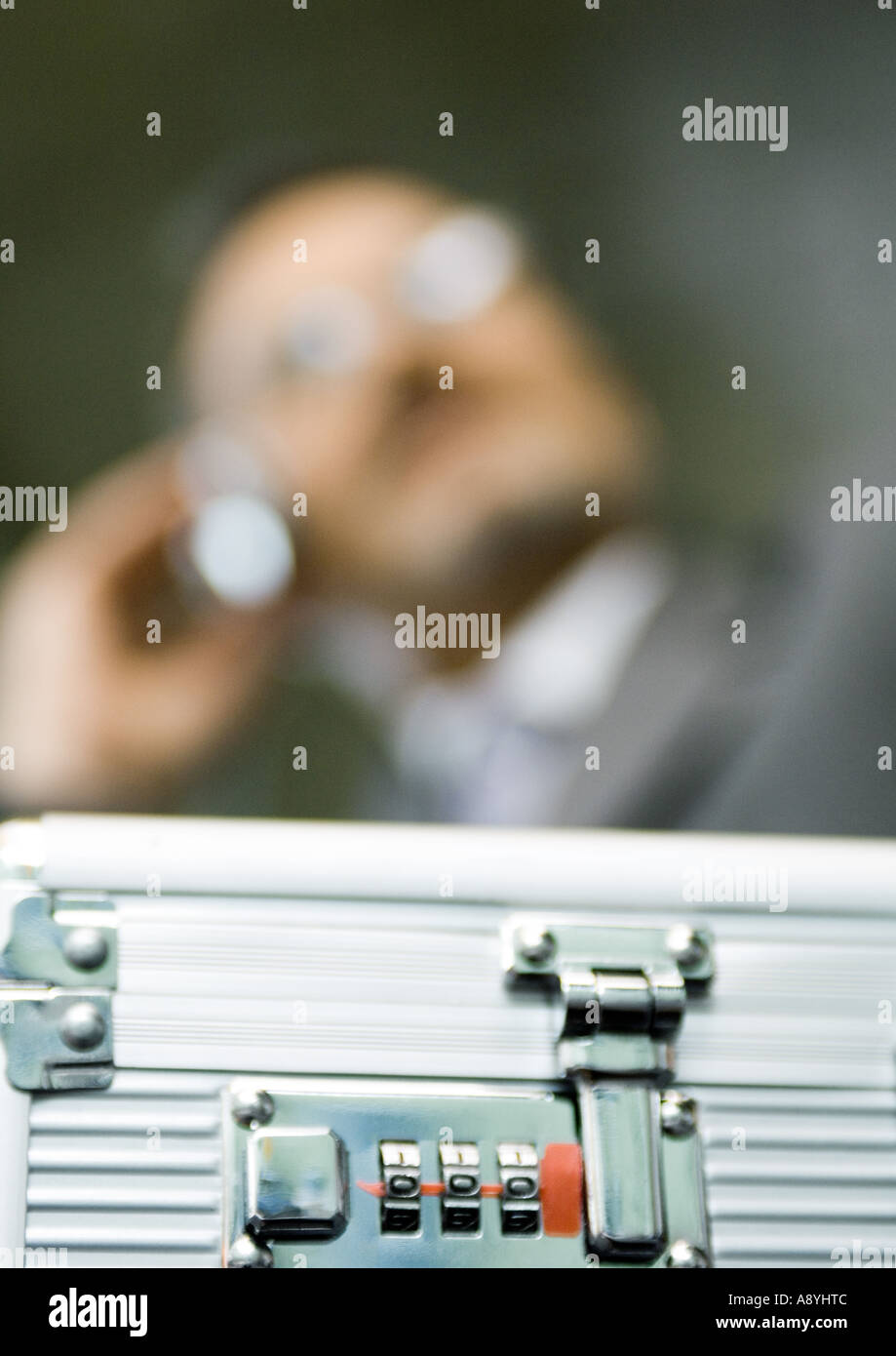 Combination lock on briefcase, extreme close-up Stock Photo - Alamy