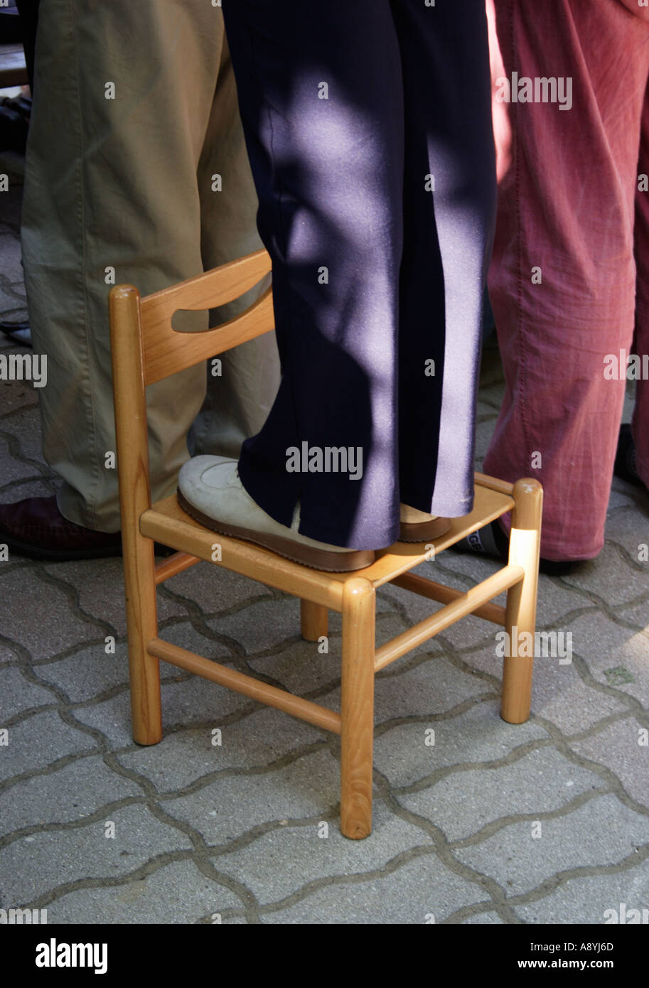 foot feet on chair Stock Photo - Alamy
