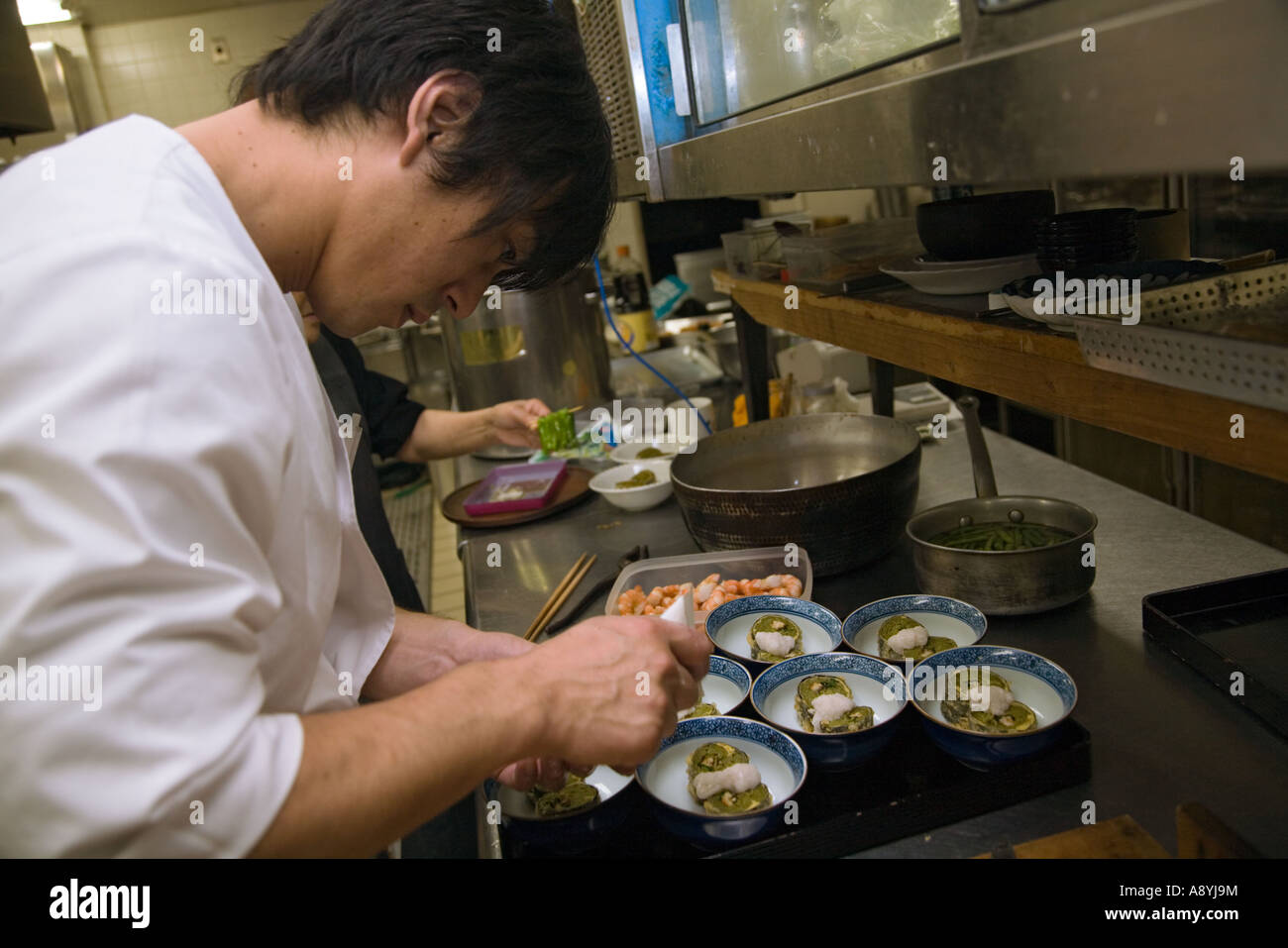 Preparing dishes of tempura soba in a Japanese restaurant Stock Photo ...