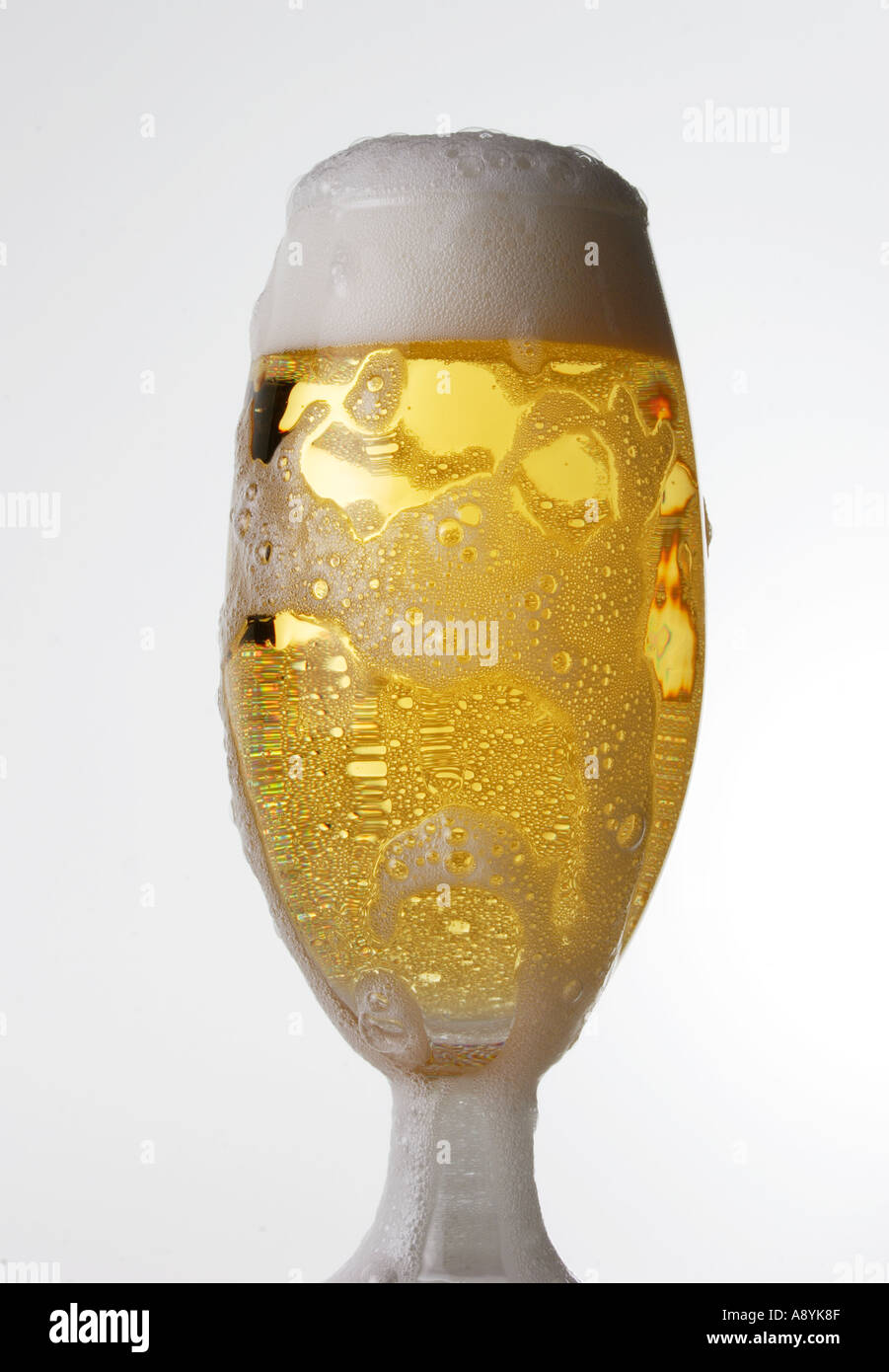 glass beer yellow foam spume froth Stock Photo - Alamy