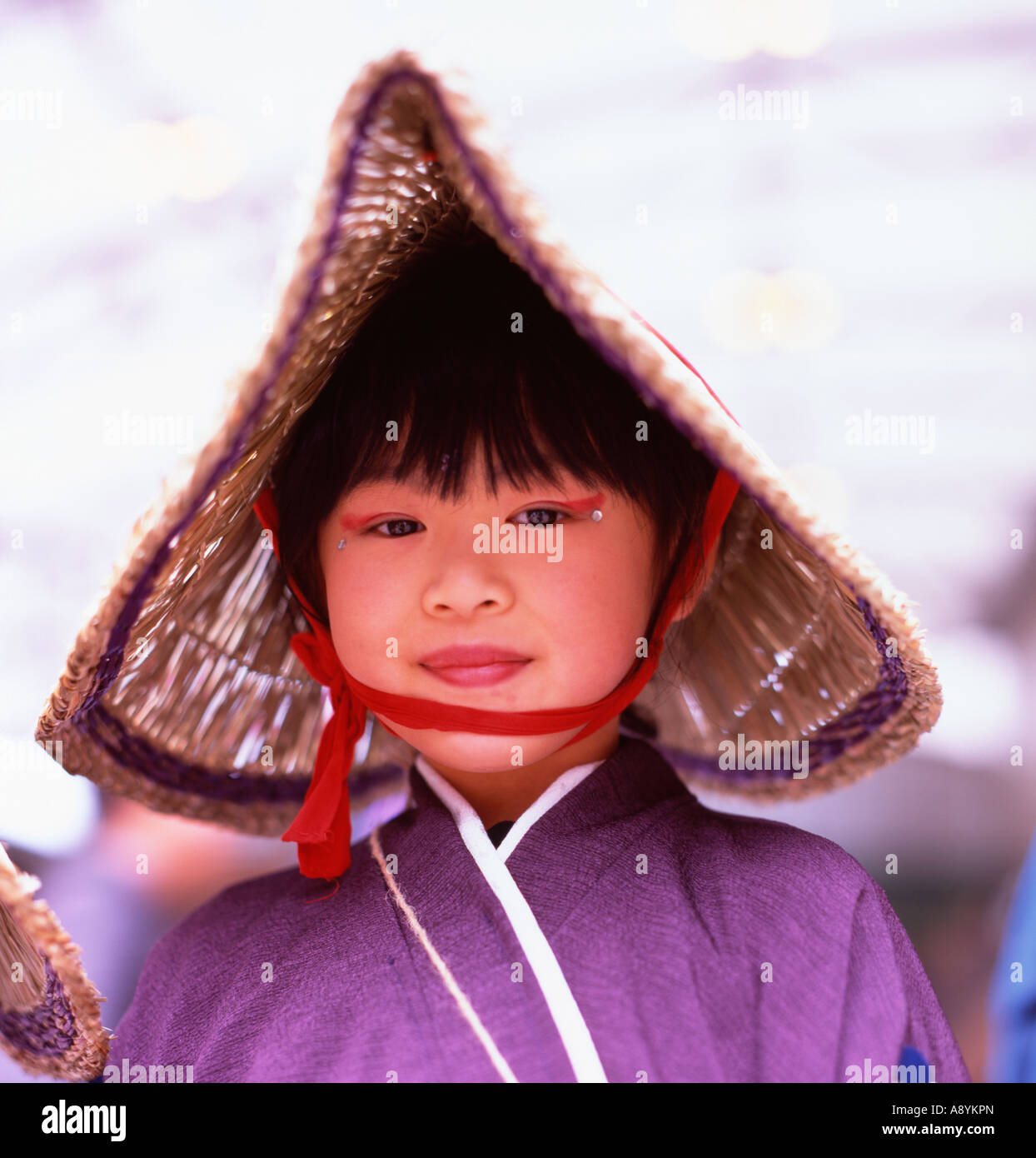 Young girl wearing yukata and hat taking part in Yosakoi Festival in ...