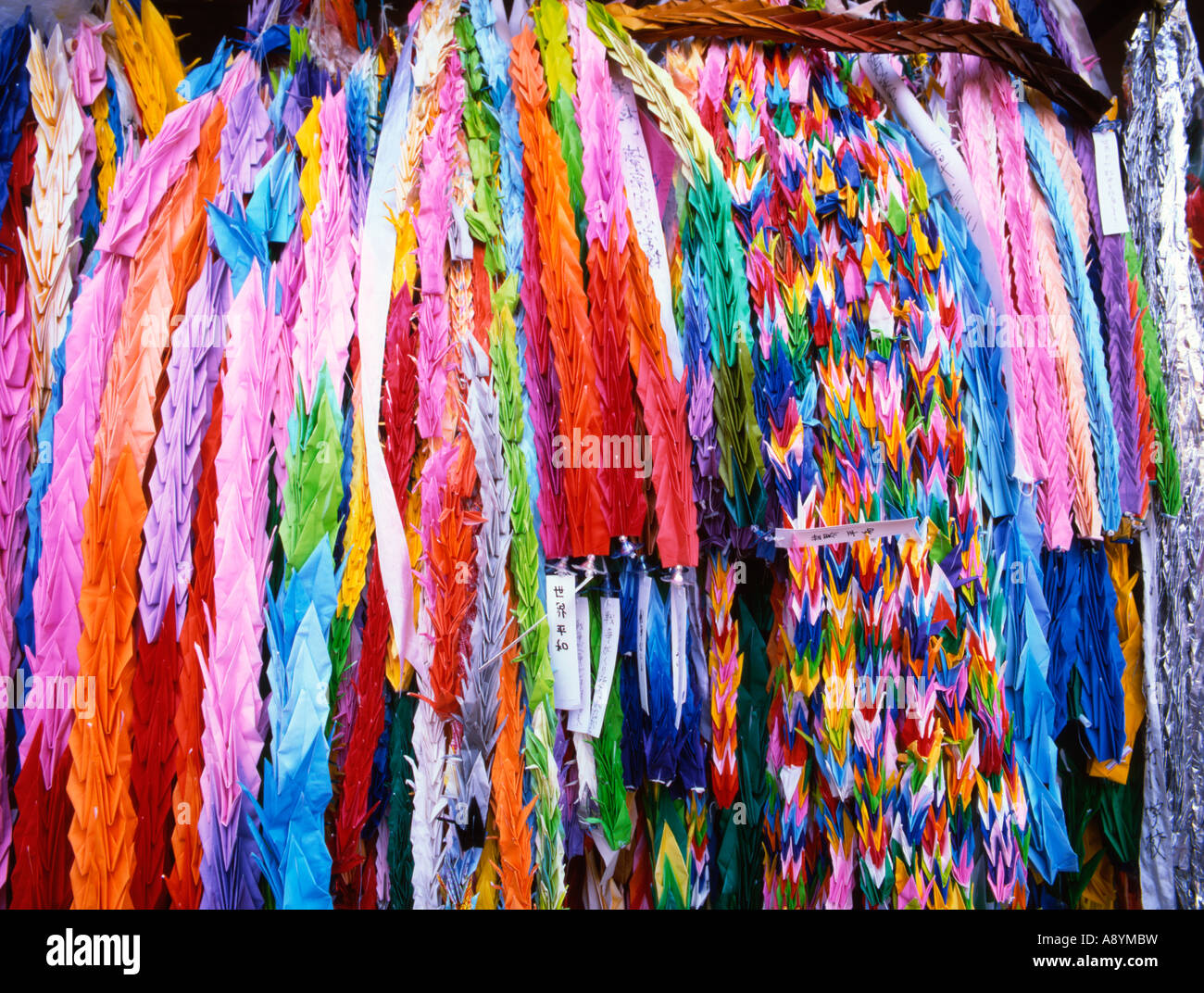 Chains of origami cranes beside the pillar marking the hypocenter of ...