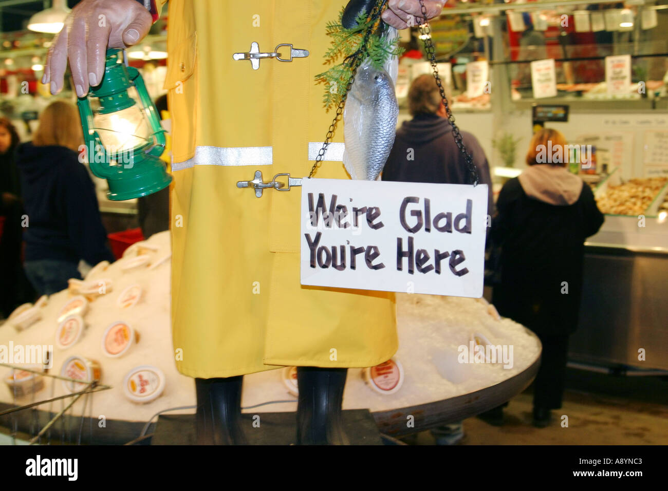 Welcome sign in fish store Stock Photo - Alamy