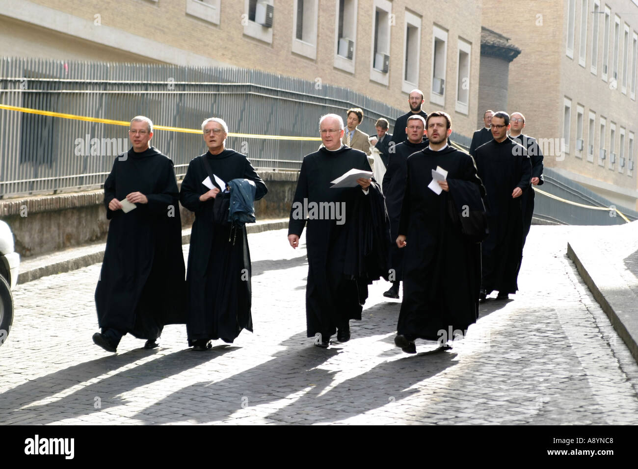 Priests walking in street hi-res stock photography and images - Alamy