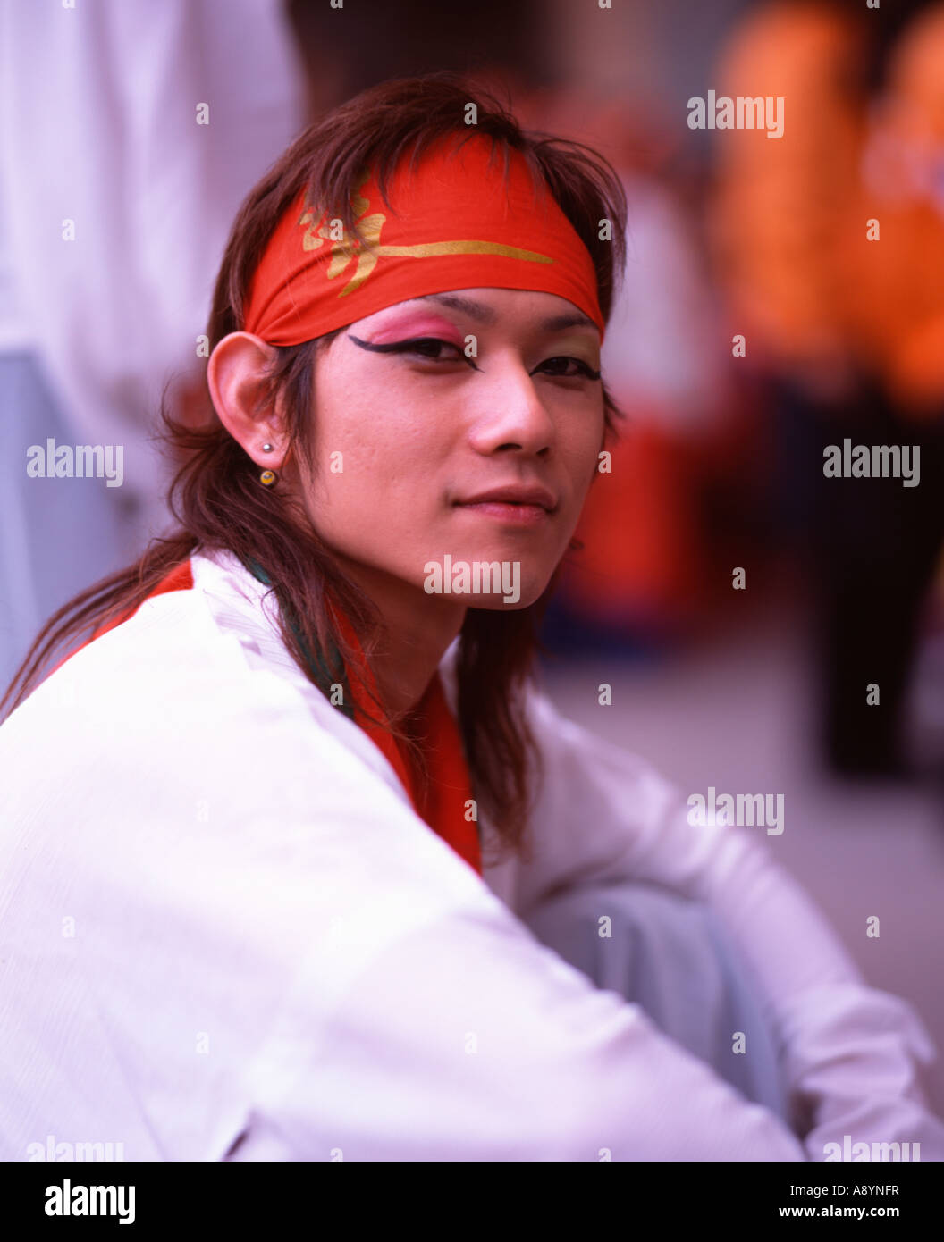 Handsome young Japanese man dressed in costume taking part in a yosakoi ...