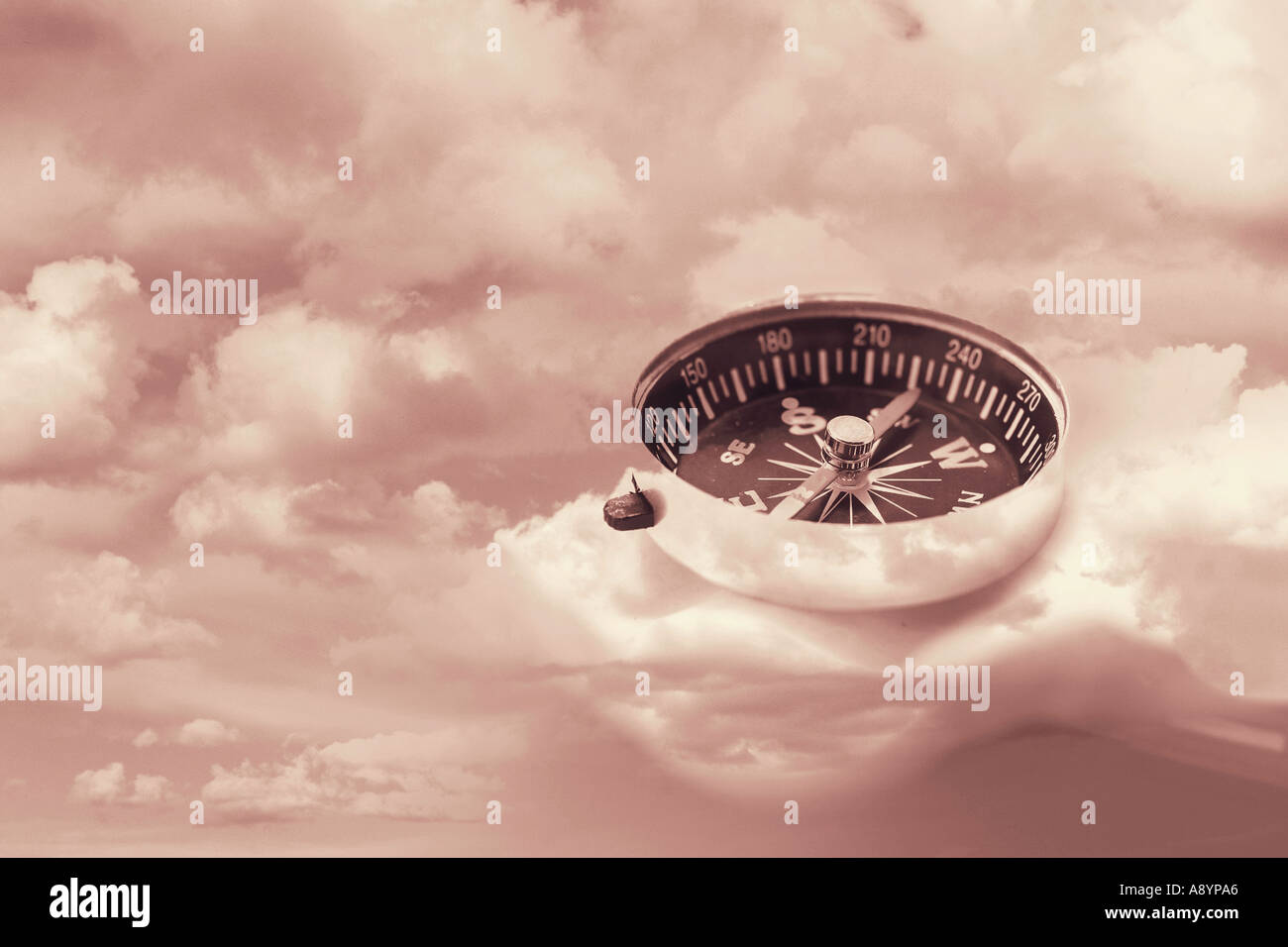 Compass and Clouds Stock Photo - Alamy