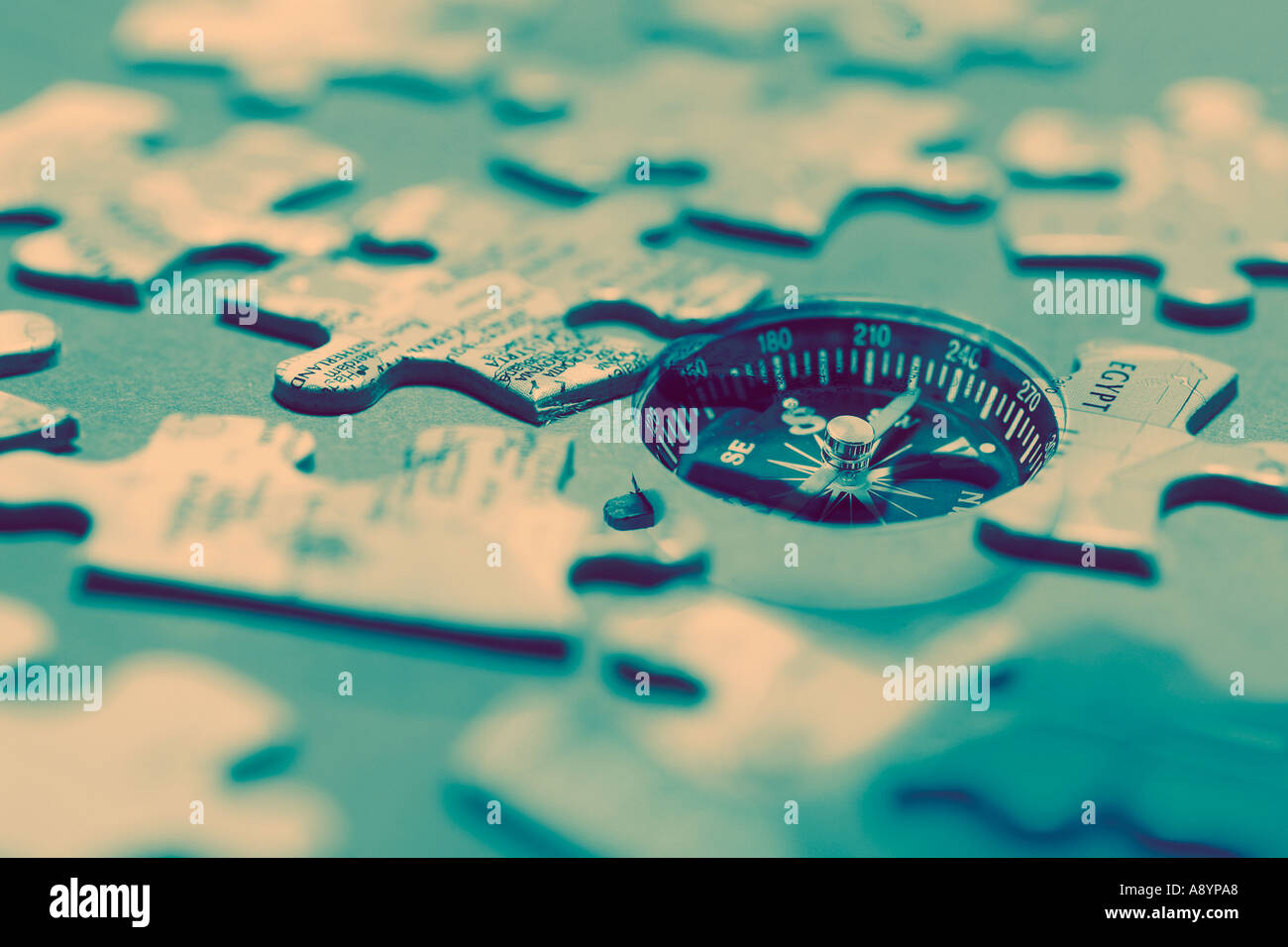 Compass and Jigsaw Puzzle Pieces Stock Photo - Alamy