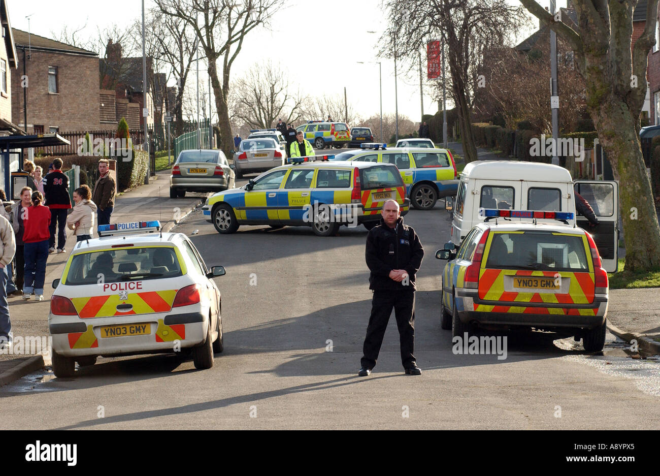 Armed police response units in action at a UK housing estate Stock ...