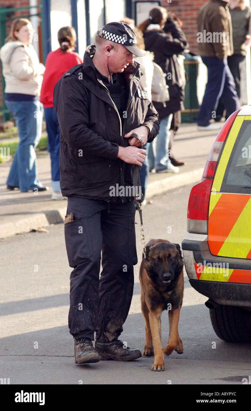 Armed police response units in action at a UK housing estate including ...