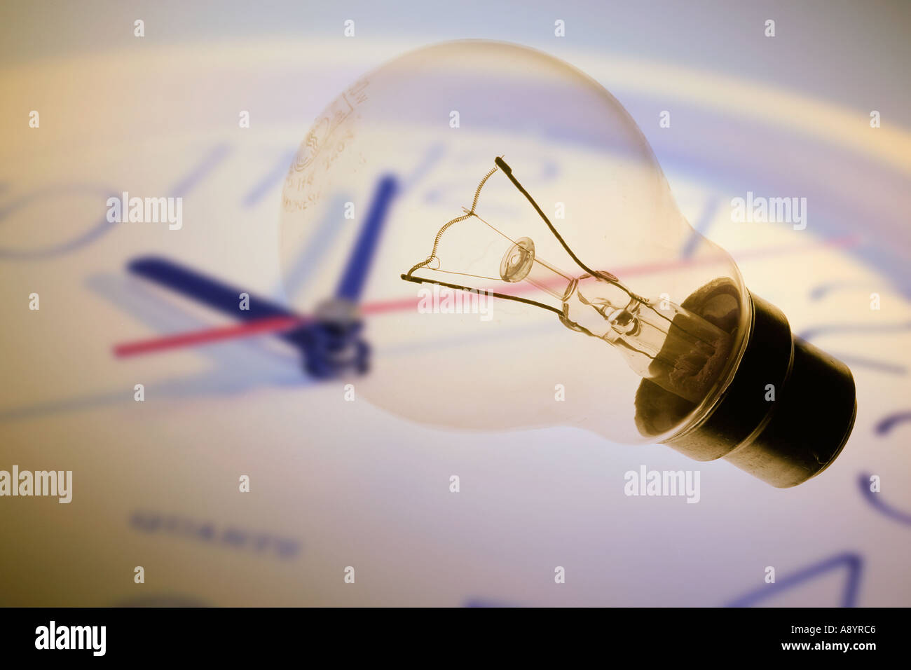 Clock and Light Bulb Stock Photo - Alamy